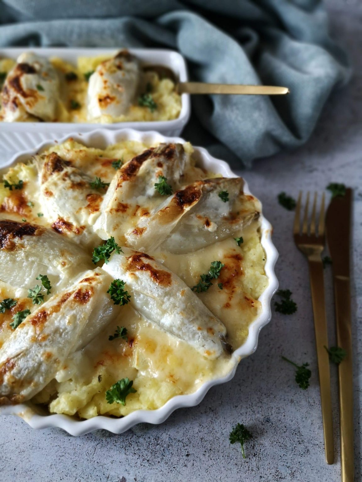 Witlof met kaas en aardappelpuree uit de oven